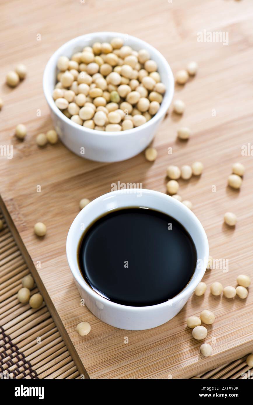 Soy Sauce in a bowl (close-up shot) on bamboo background Stock Photo ...