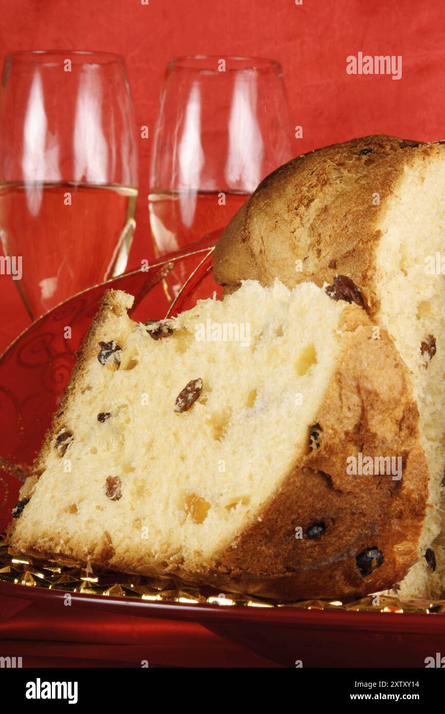 Panettone the italian Christmas fruit cake served on a red glass plate ...