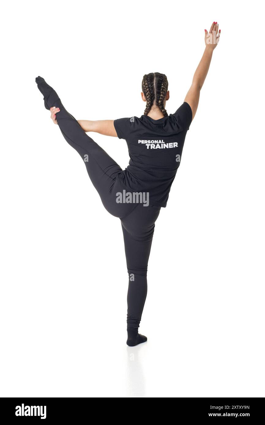 Personal Trainer standing with one leg up, isolated in white Stock ...