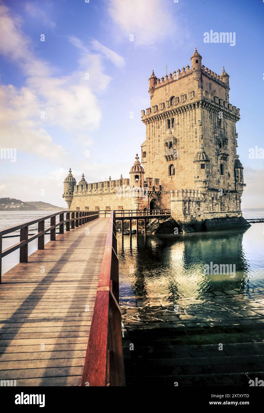 Belem Tower with bridge right before sunset Stock Photo - Alamy