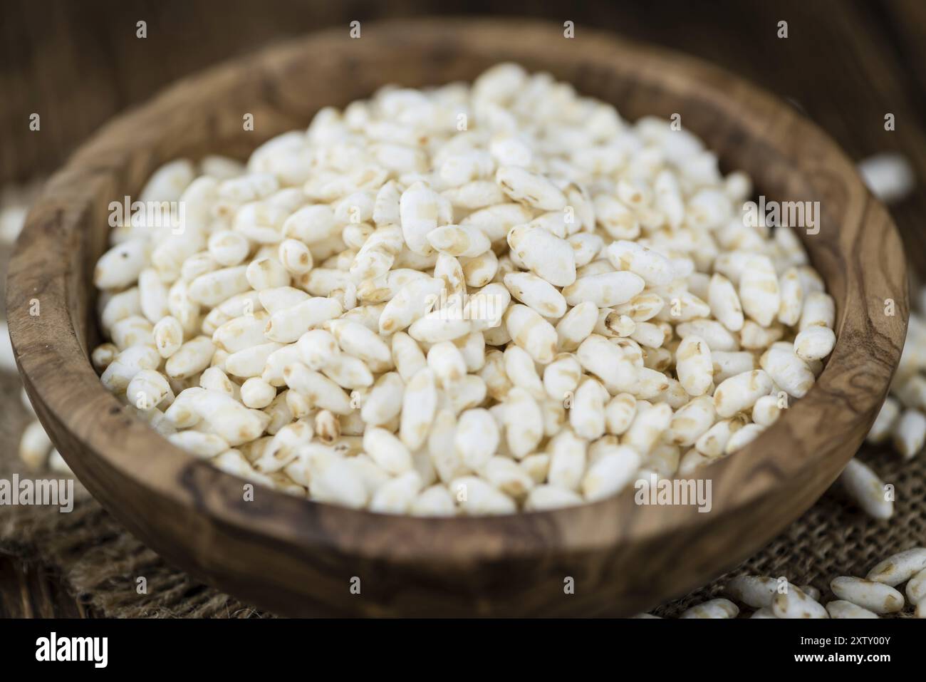 Wooden table with puffed Rice (detailed close-up shot Stock Photo - Alamy
