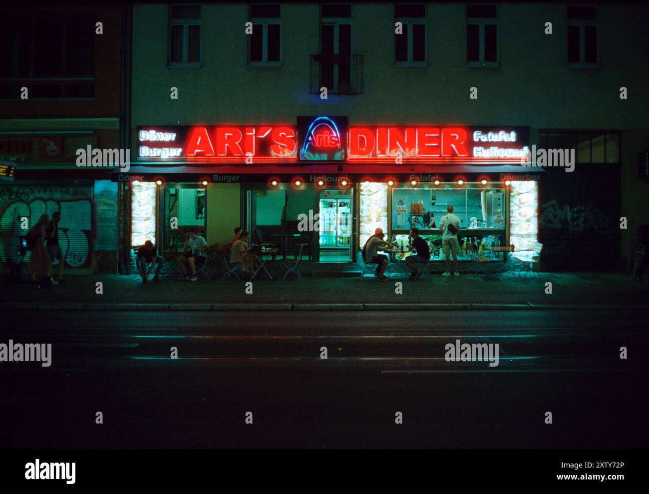 Neon signs outside arab restaurant at night in Berlin Stock Photo - Alamy
