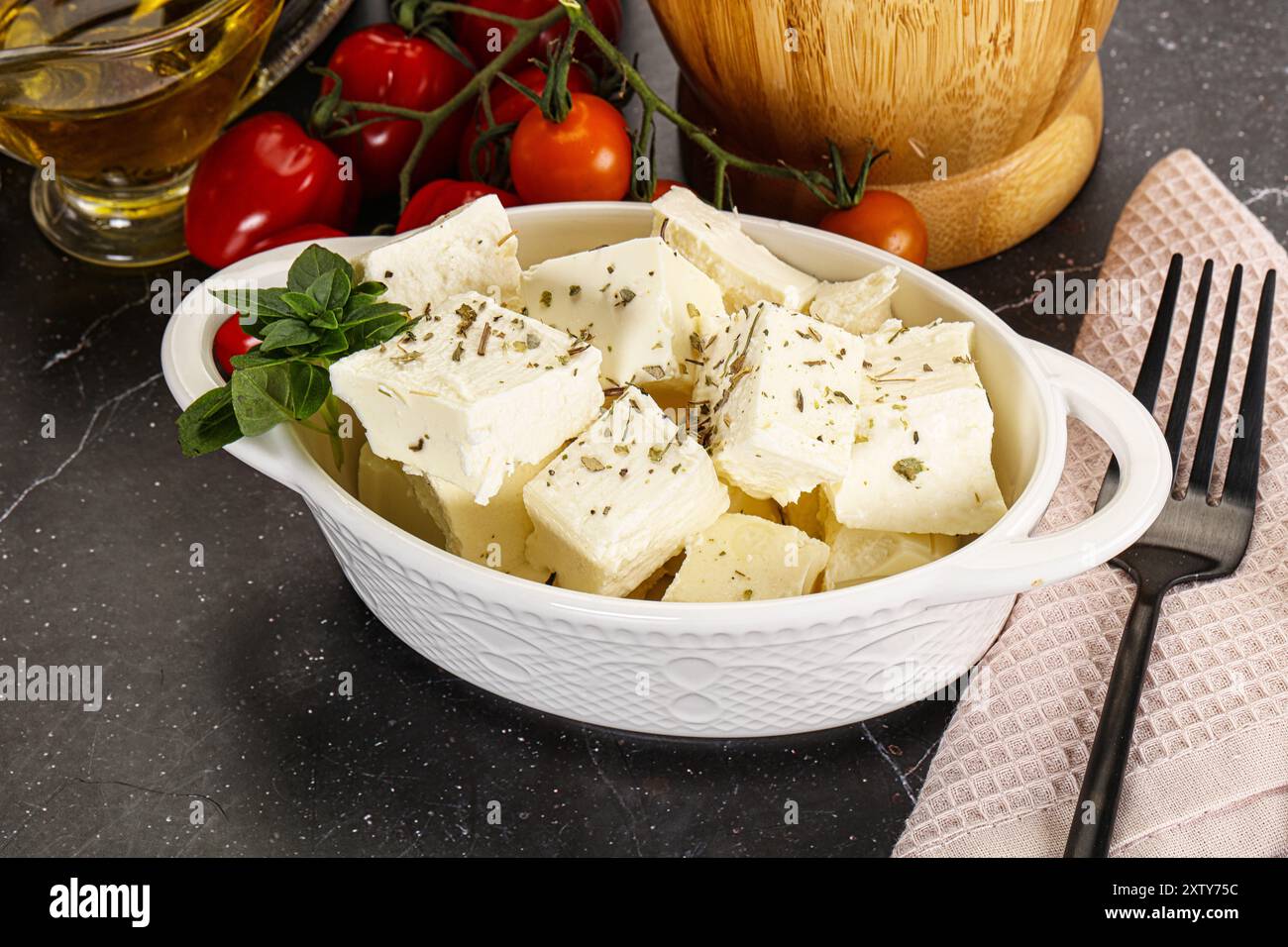Greek traditional Feta cheese cubes with herbs and spices Stock Photo ...