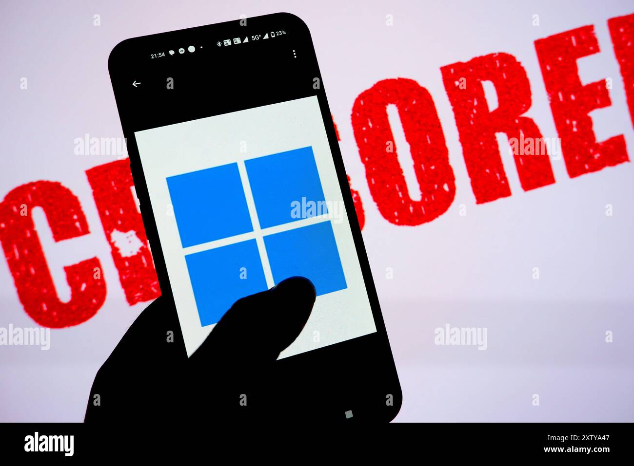 In this photo illustration, a Microsoft logo seen displayed on a ...