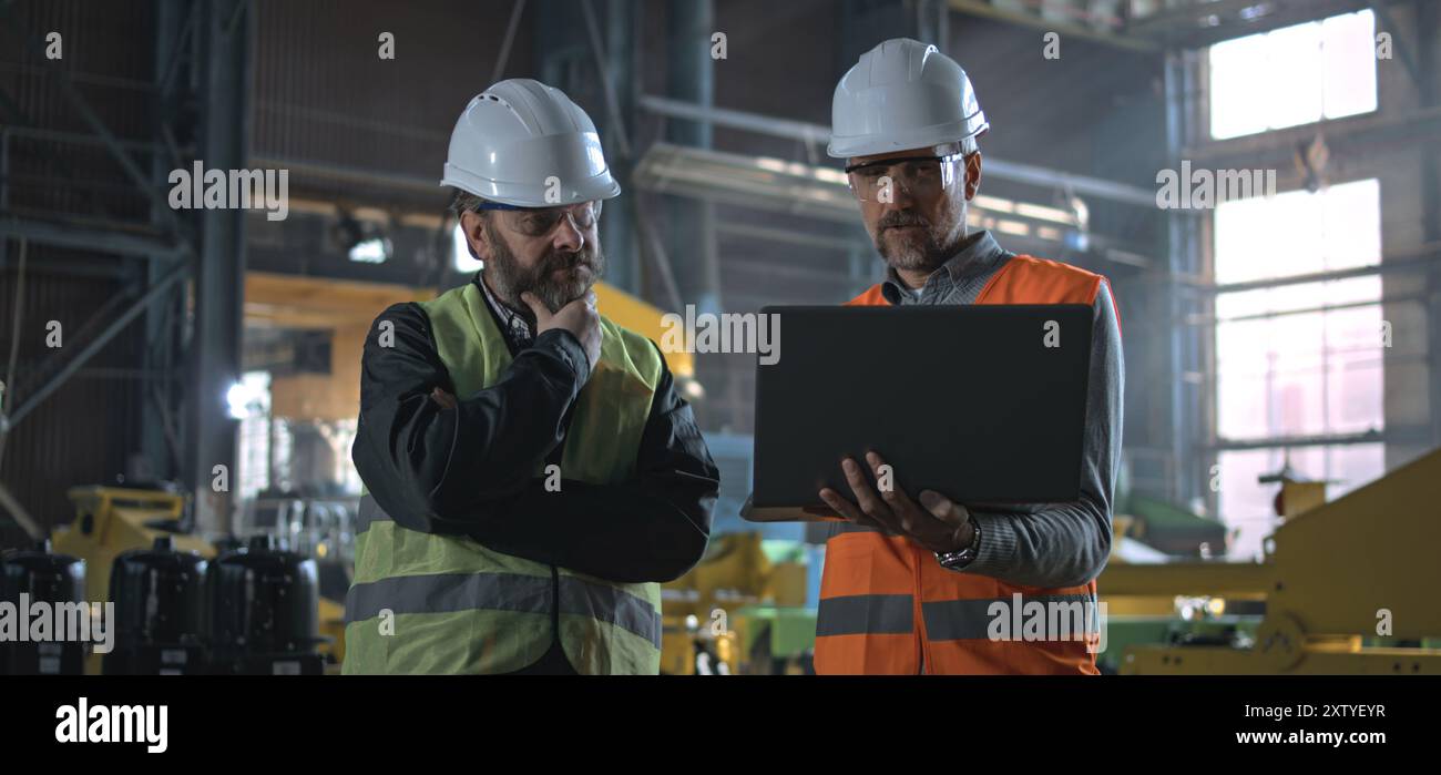 Engineers in factory warehouse two hi-res stock photography and images ...