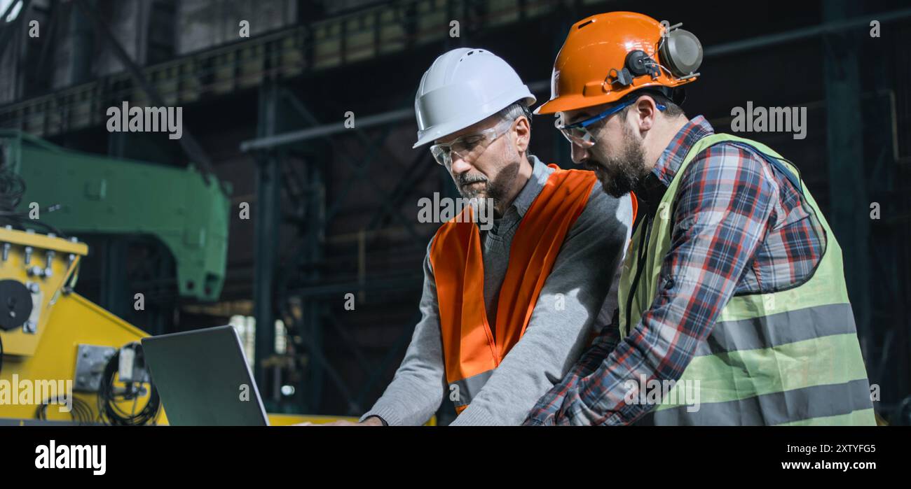 Male employee uses machine hi-res stock photography and images - Alamy