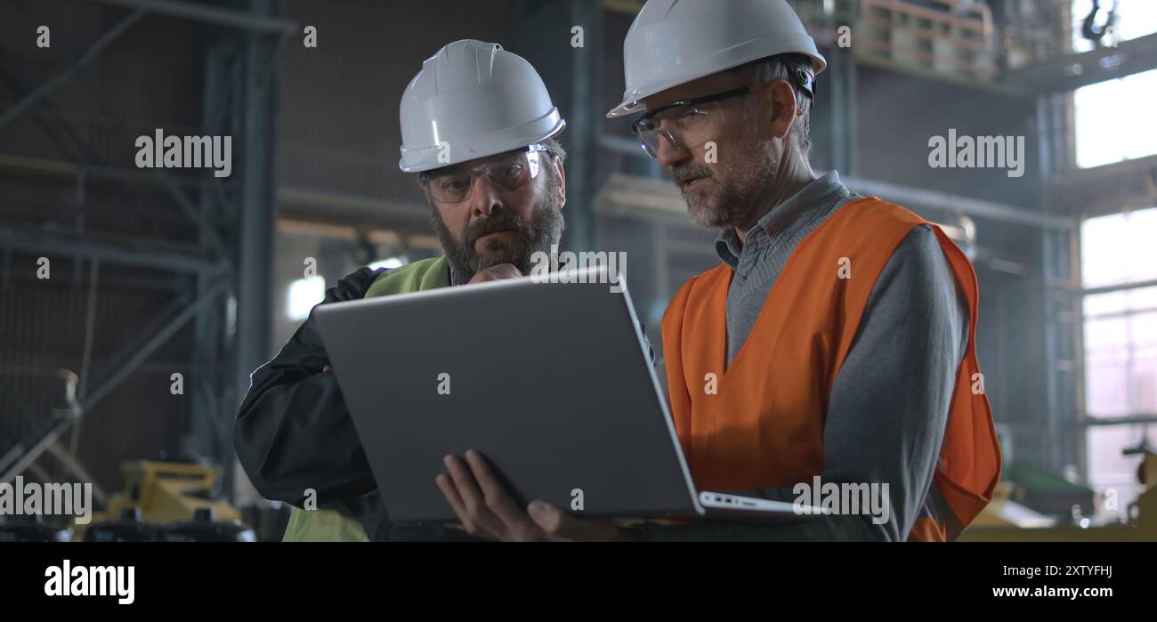 Engineers in factory warehouse two hi-res stock photography and images ...