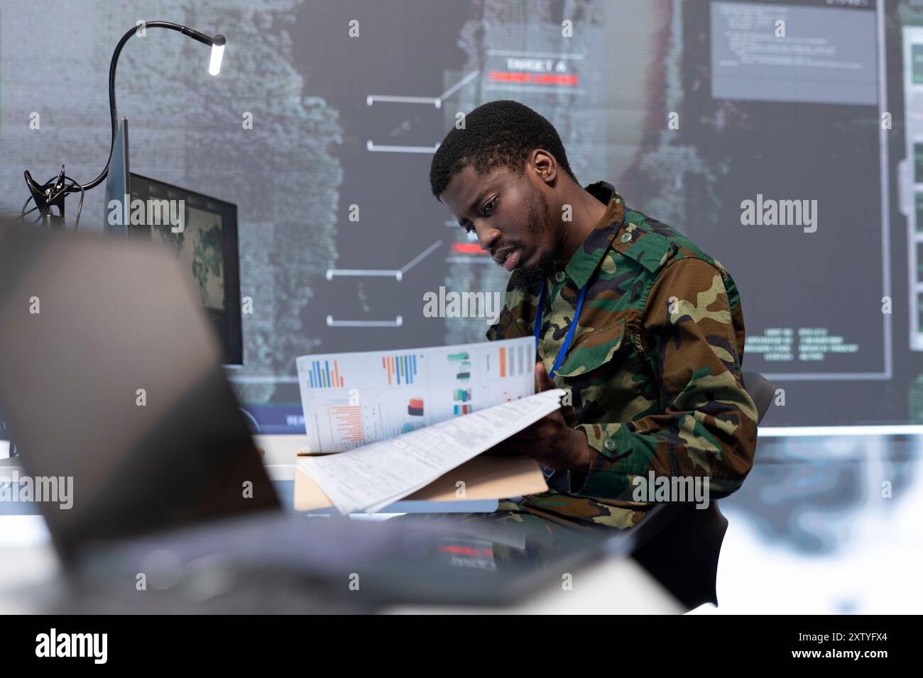 Military team manages cybersecurity operations in a high tech control ...