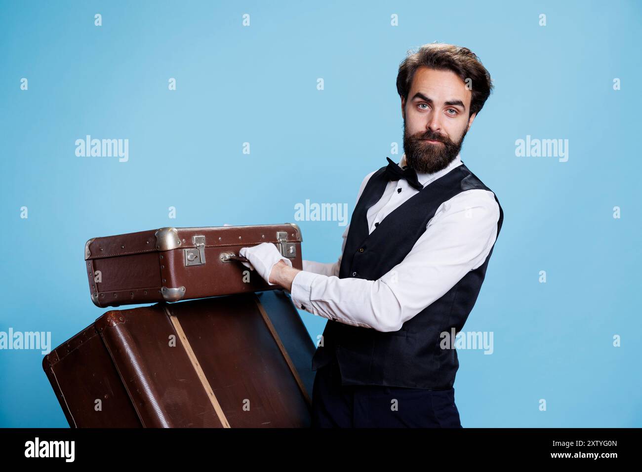 Friendly bellhop shows satisfaction, illustrating role as an ...