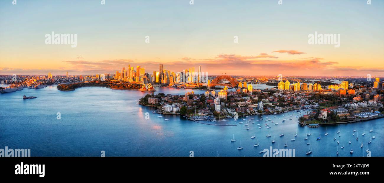 Sunlit aerial cityscape panorama of Sydney harbour shores - landmarks ...