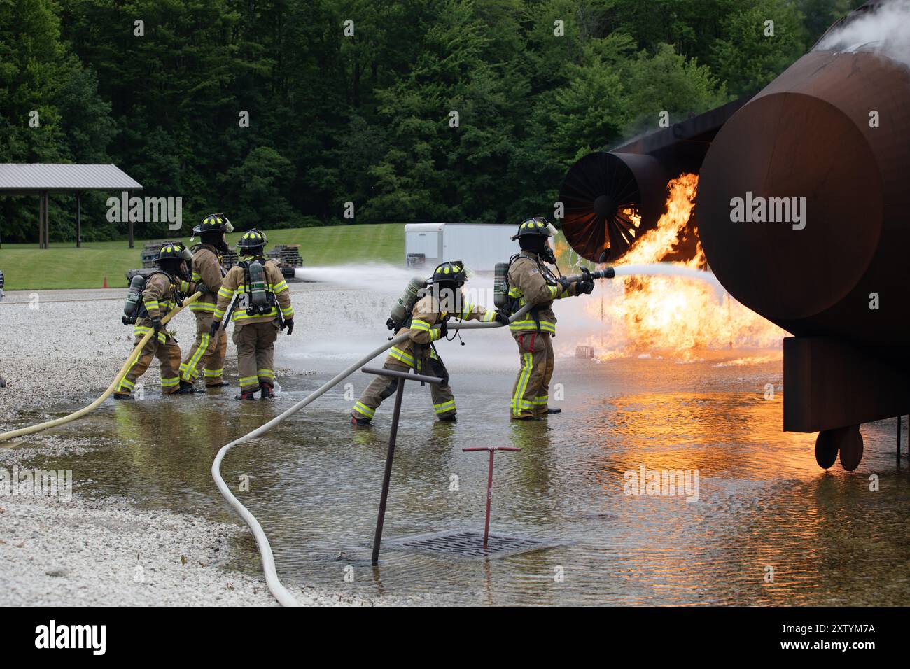 Firefighters of the 295th Engineer Detachment participate in a plane ...