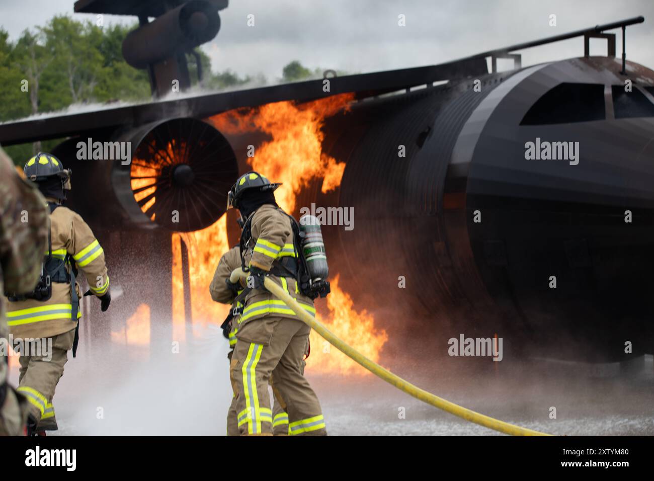 Firefighters of the 295th Engineer Detachment participate in the plane ...