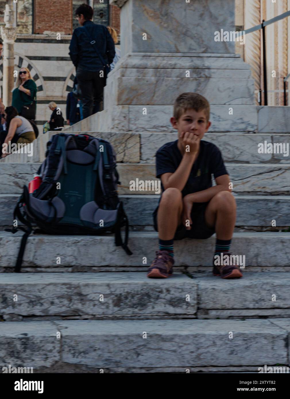Boy siting resting his head on his hand hi-res stock photography and ...