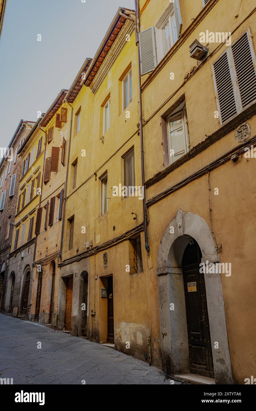 Colorful yellow buildings in Siena, Italy Stock Photo - Alamy