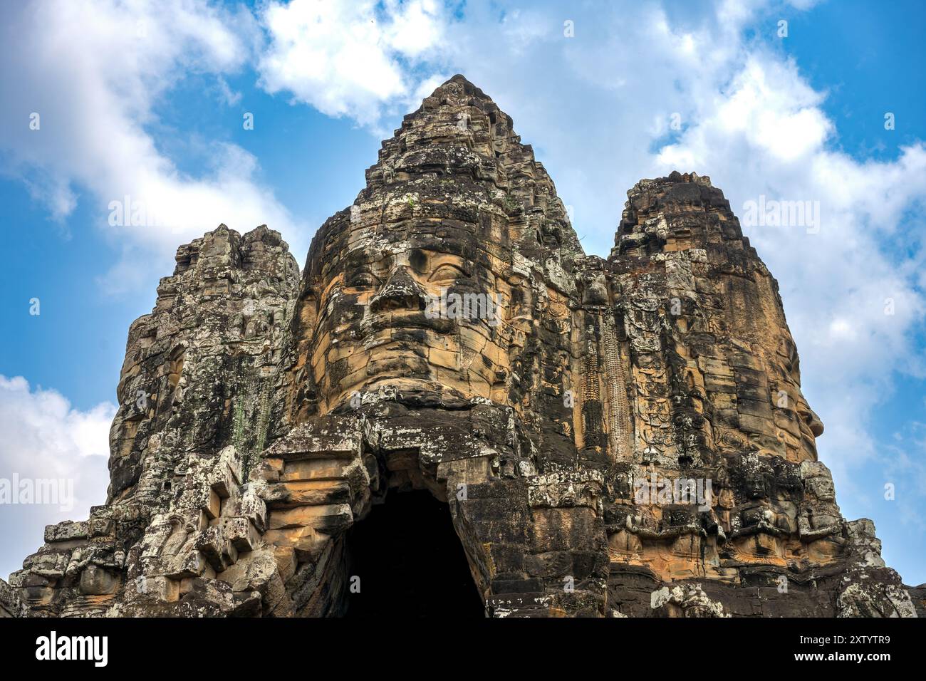 Details of the face carvings above the south gate at Bayon temple ...