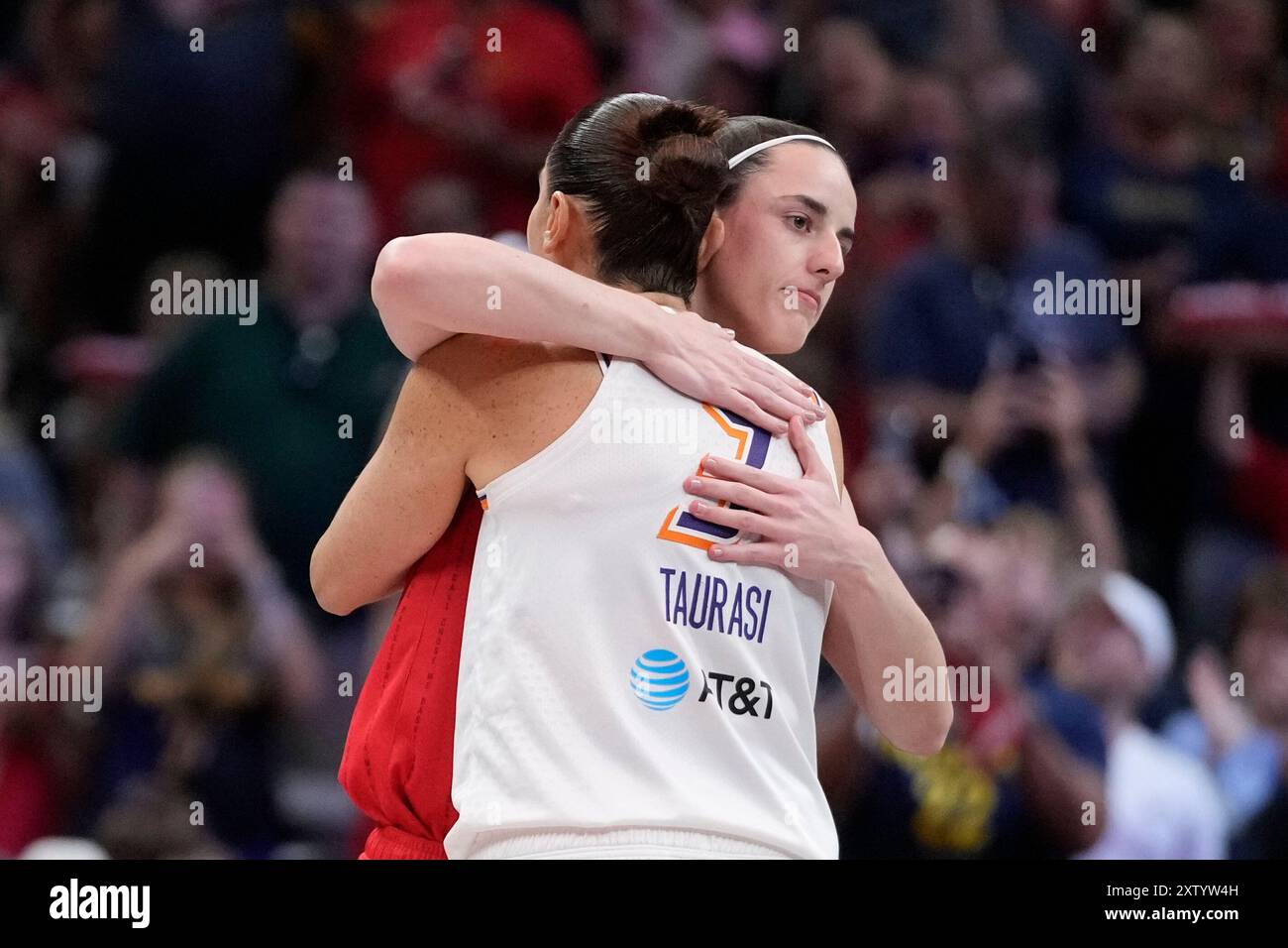 Indiana Fever guard Caitlin Clark hugs Phoenix Mercury's Diana Taurasi (3) before the first half ...