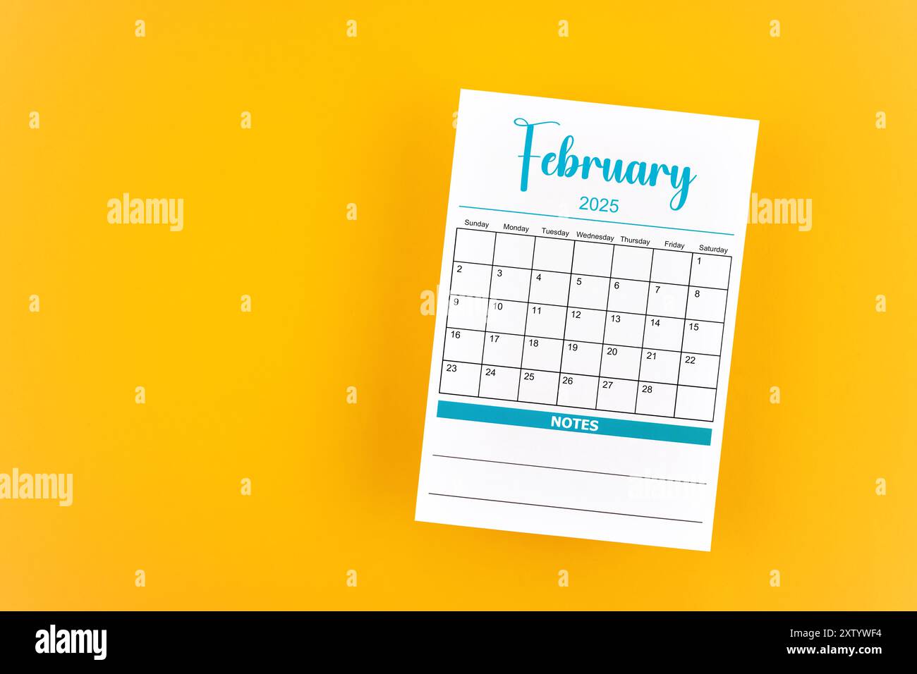 February 2025 calendar page on yellow color background Stock Photo - Alamy