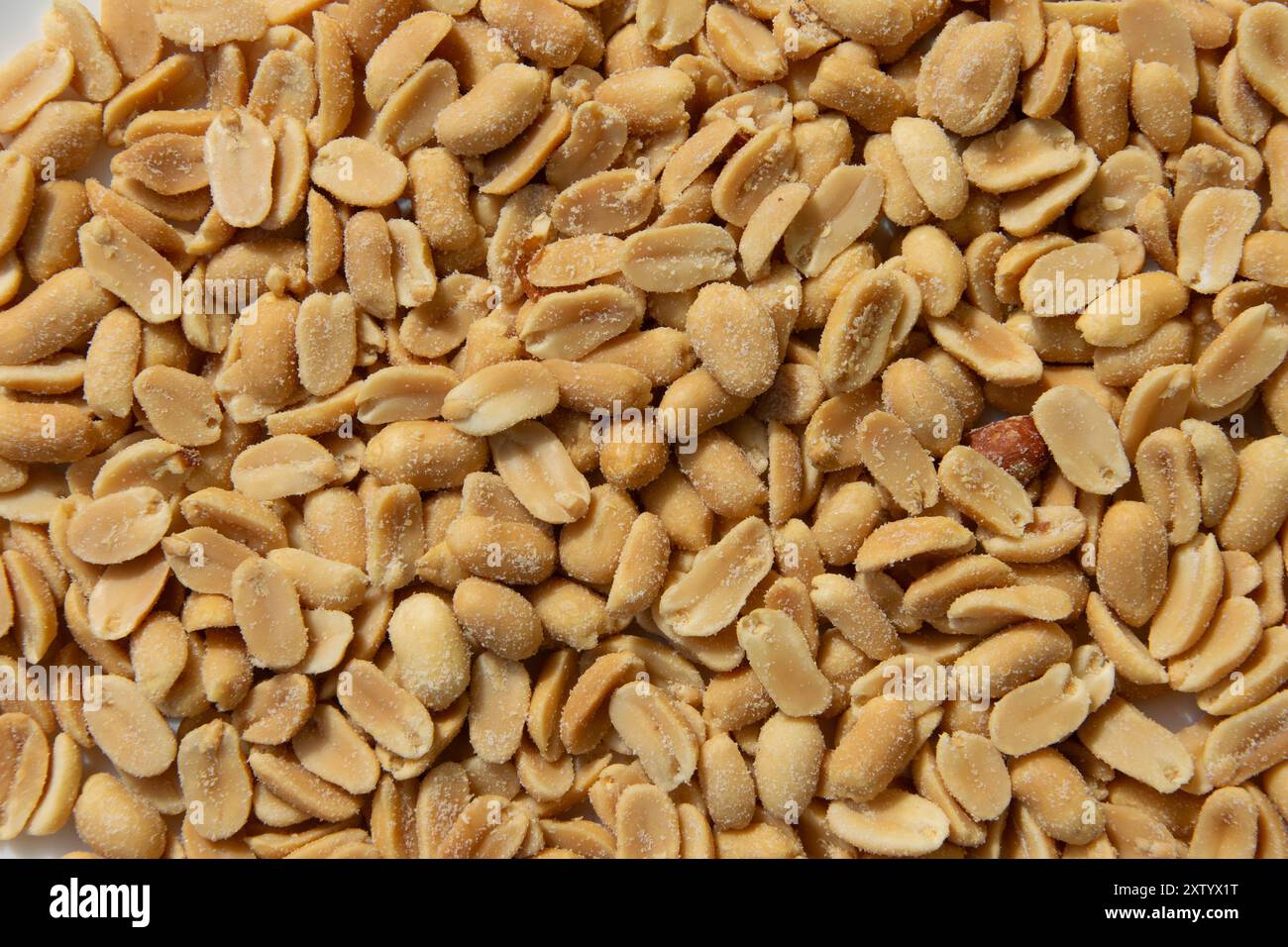 peanuts scattered on a white background Stock Photo - Alamy