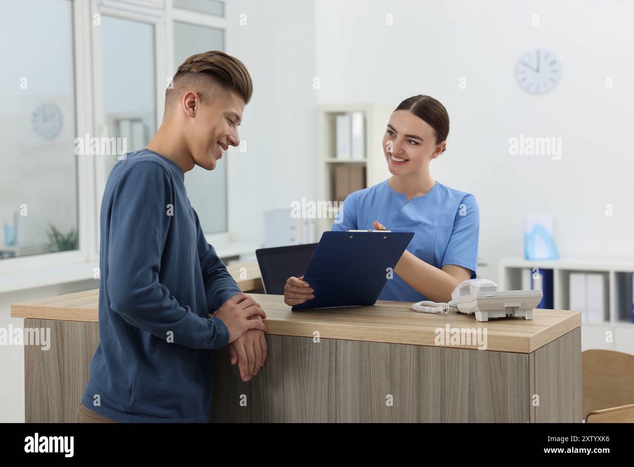 Patient document nurse reception hi-res stock photography and images ...