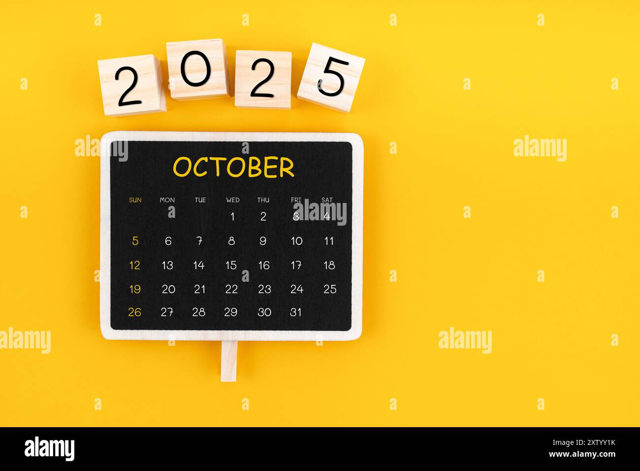 Calendar for October 2025 in black chalkboard with copy space on a ...