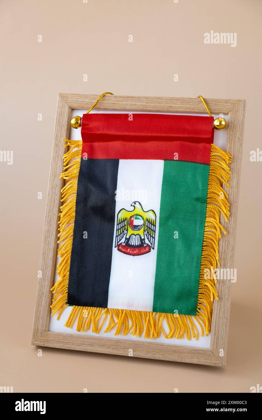 Small flag of UAE in beige background. Copy space. Mock up ...