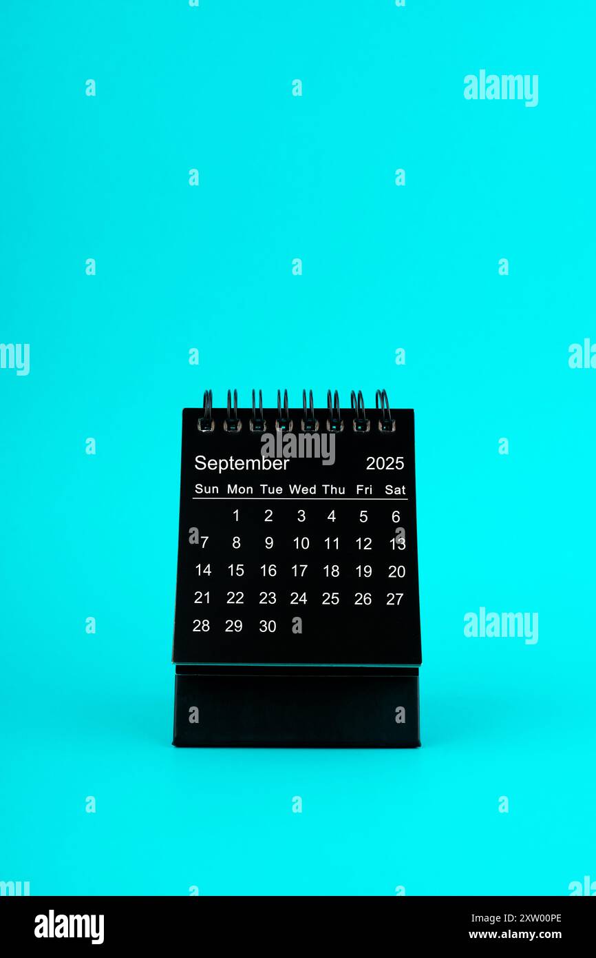 Black Calendar for September 2025. Desktop calendar on a green color ...