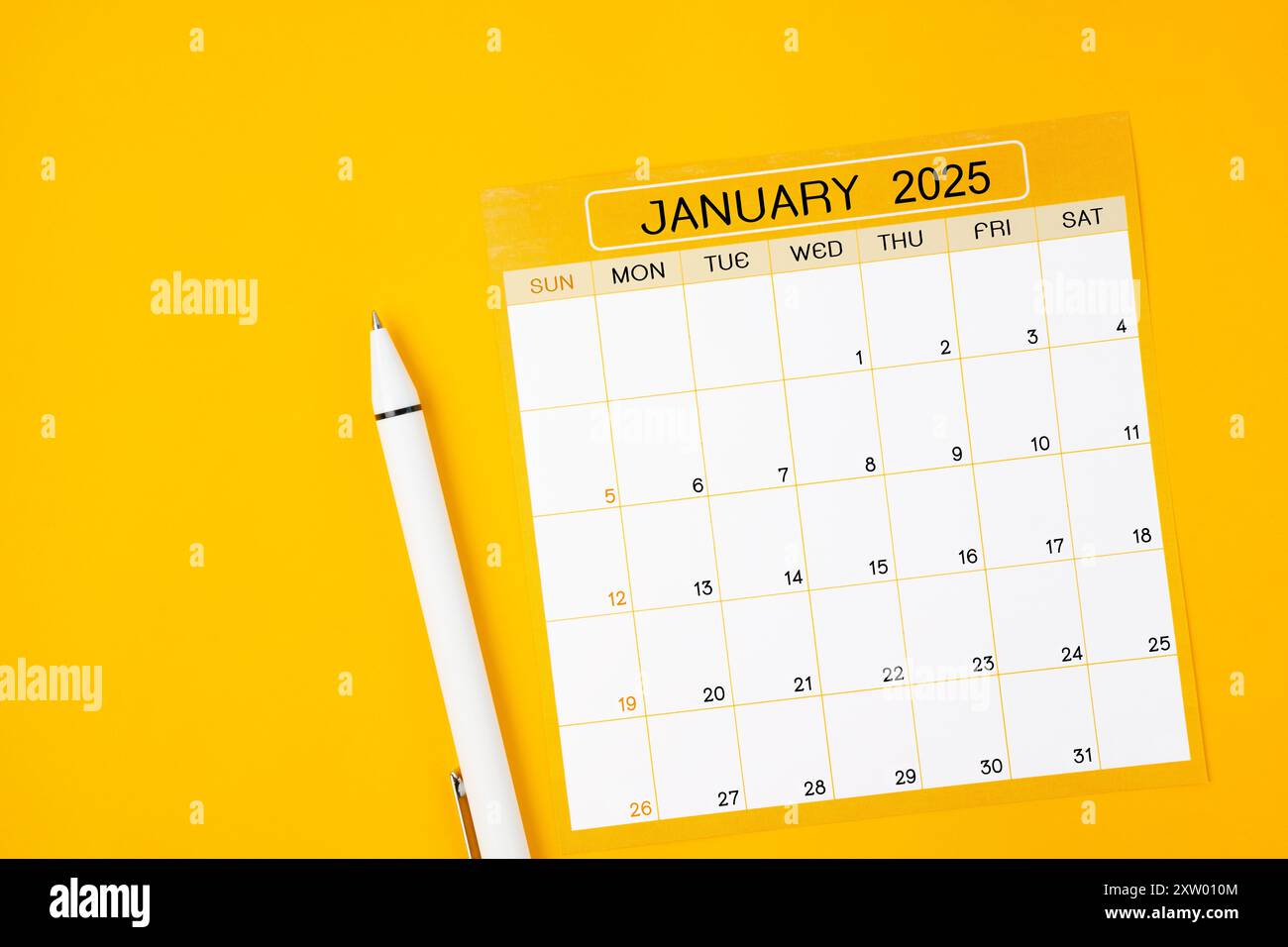January 2025 Monthly calendar for 2025 year with pen on yellow color ...