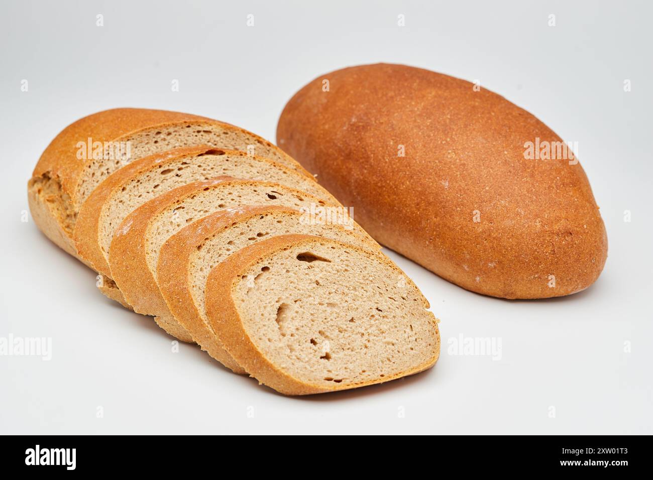 Whole wheat bread loaf sliced, showcasing its hearty texture and rich ...