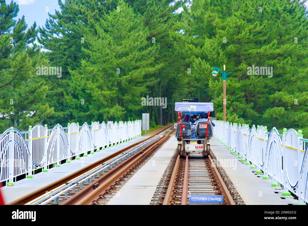 Samcheok, South Korea - July 29, 2024: A four-seater rail bike travels along the Samcheok Marine ...