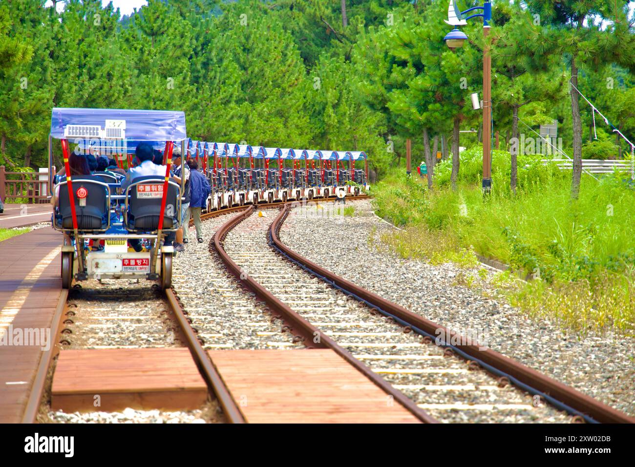Samcheok, South Korea - July 29, 2024: A line of four-seater rail bikes waits at Chogok Rest ...