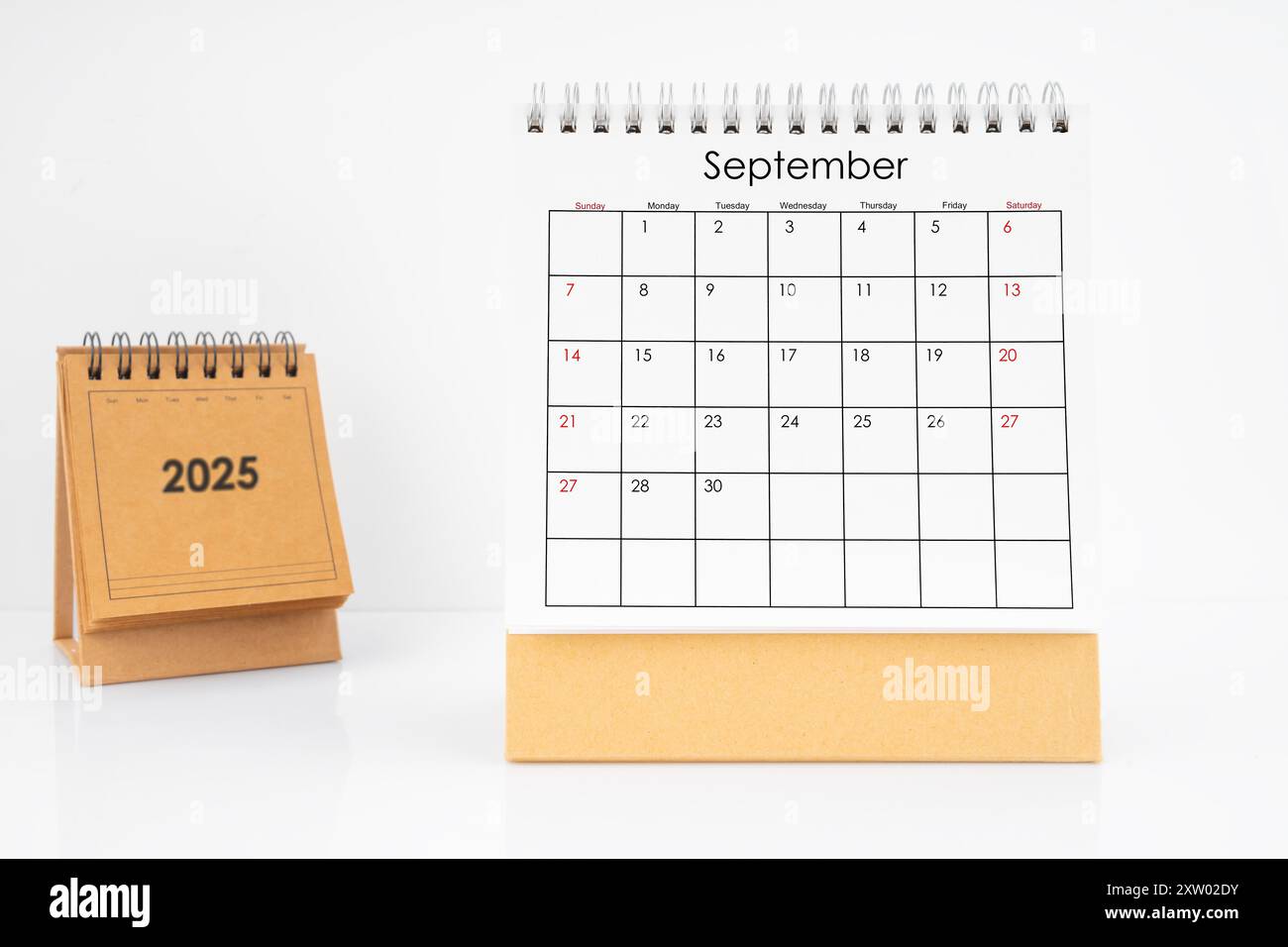 Monthly desk calendar September 2025 year on white table with white ...
