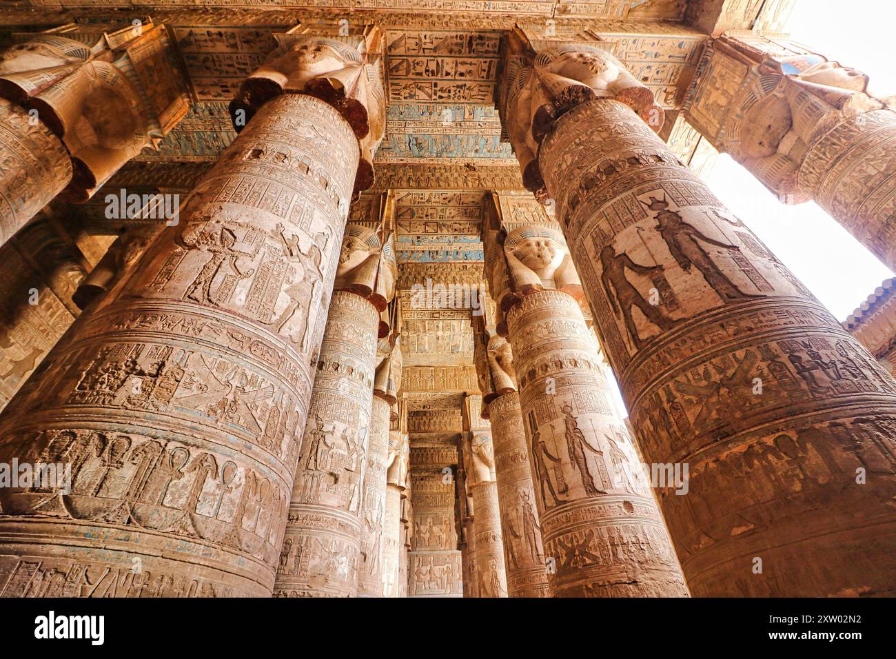 Magnificent hypostyle columns topped by faces of Hathor and vibrant ...