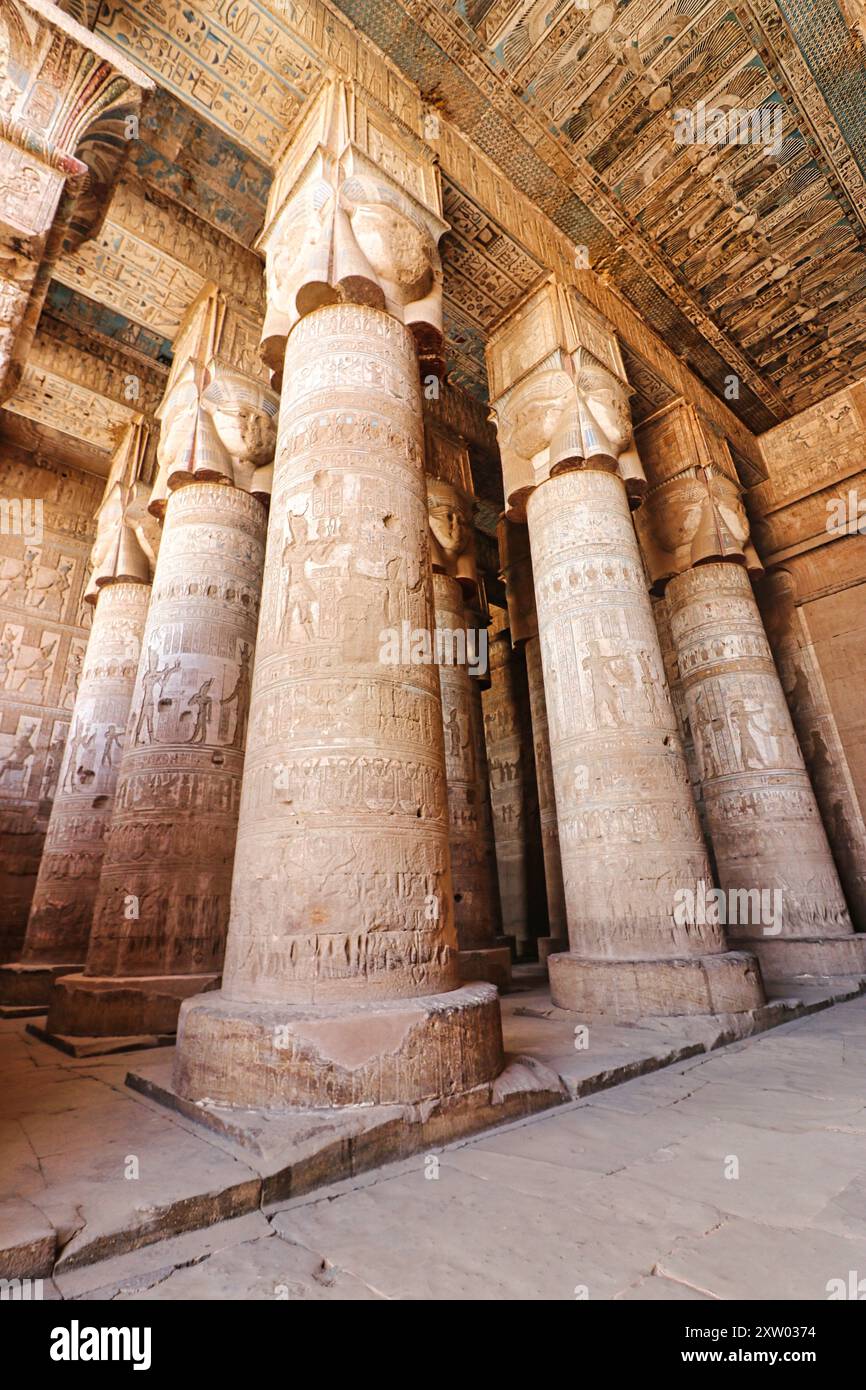 Majestic hypostyle columns topped by faces of Hathor and vibrant ...