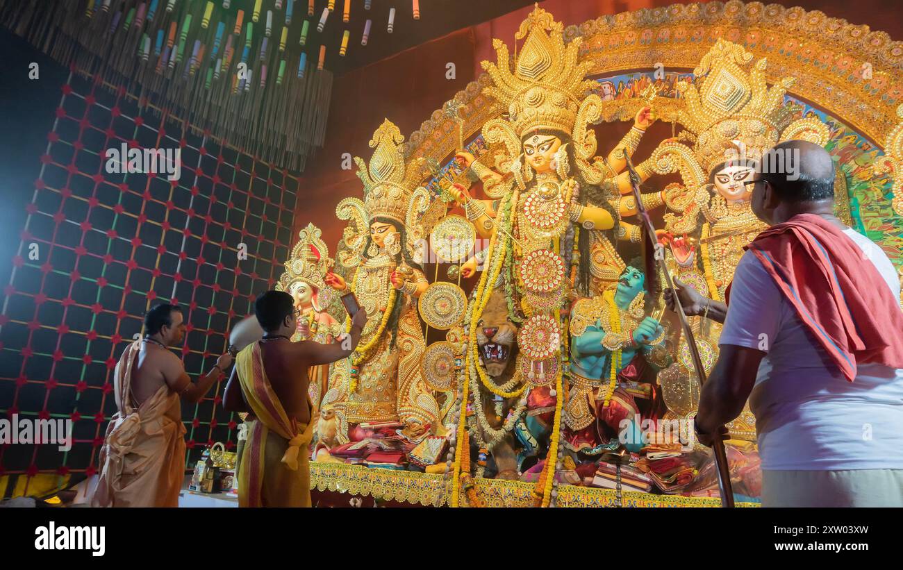 Howrah, West Bengal, India - 5th October, 2022 : Hindu Purohits worshipping Goddess Durga ...