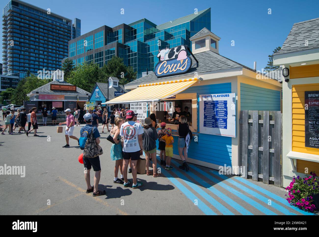 Line at COWS ice cream kiosk on the Harbourwalk on the Halifax ...