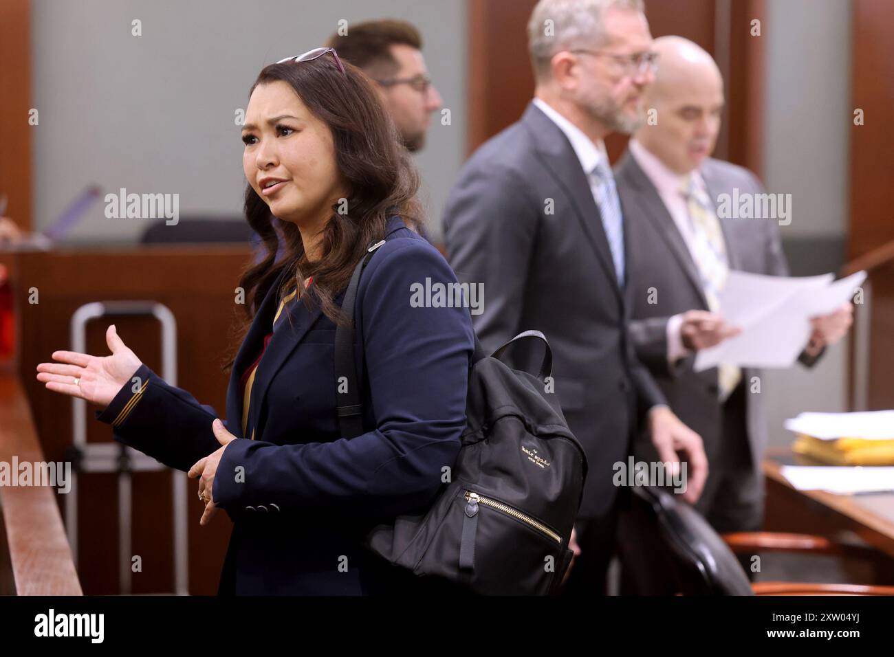 Robert Telles, right, looks at papers as his former employee Roberta ...
