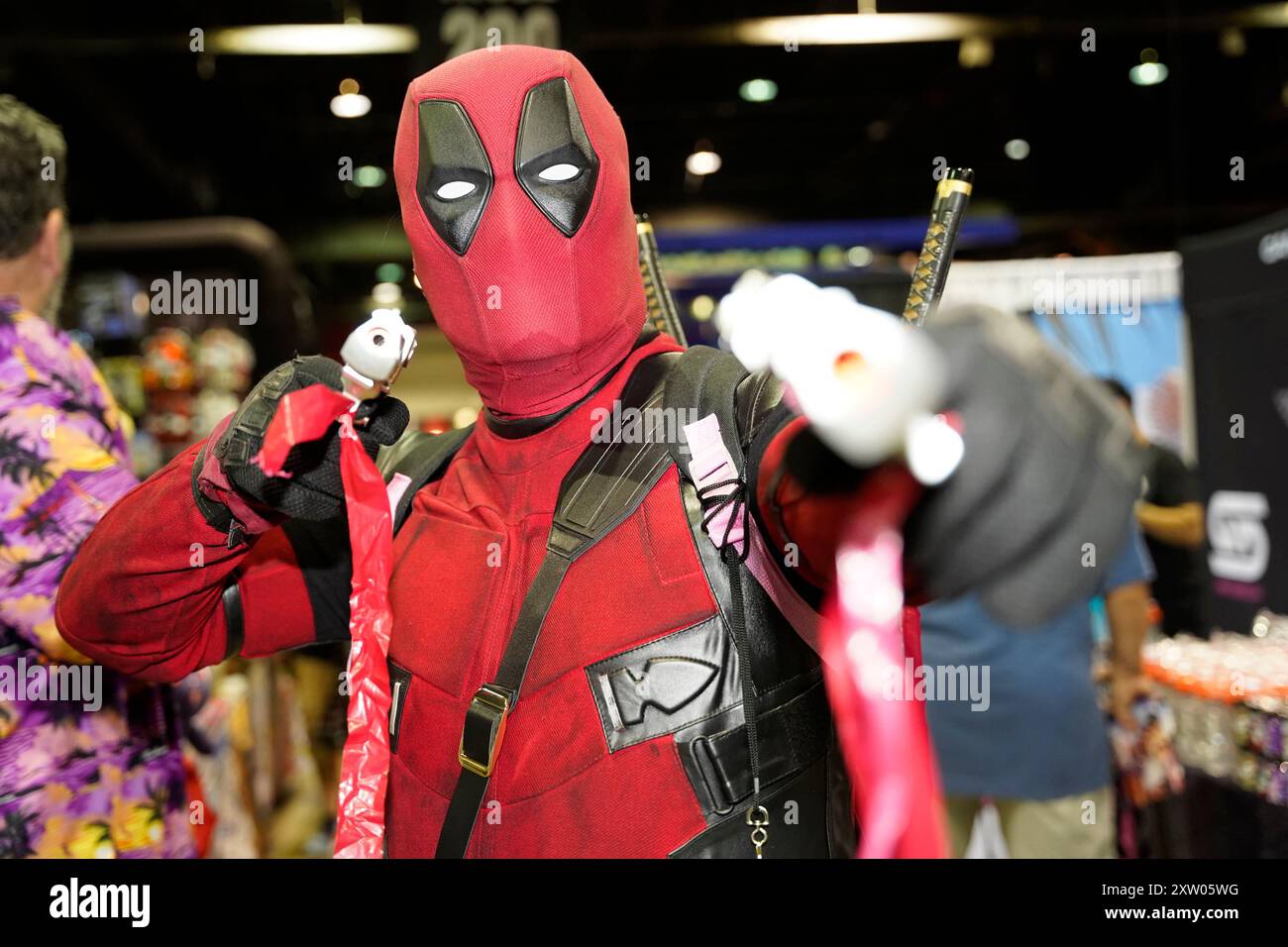 Cosplayers attend the Comic-Con Fan Expo at the Donald E. Stephens ...