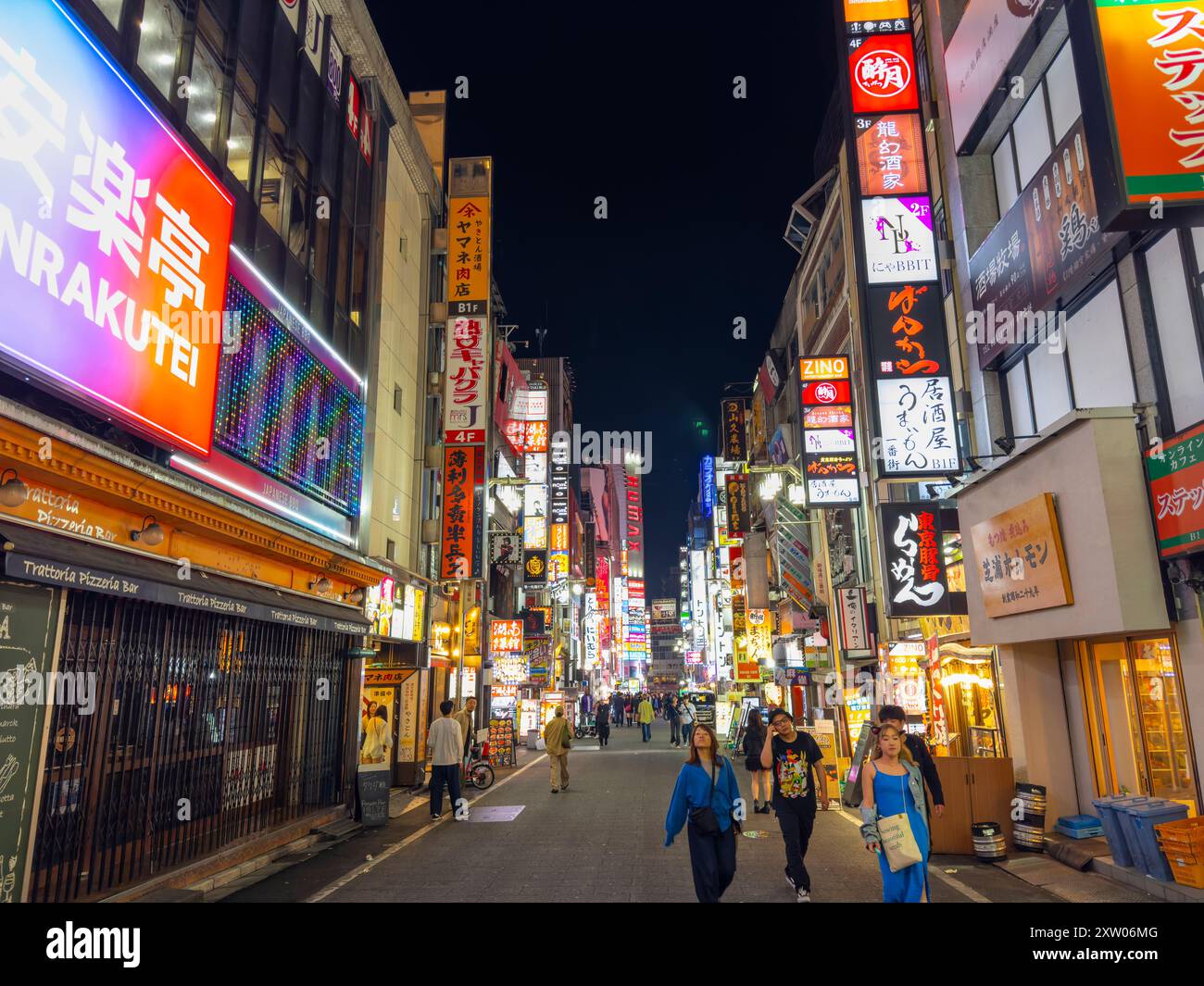 Shops and restaurants at night on Kabukicho Ichiban Gai Street in ...