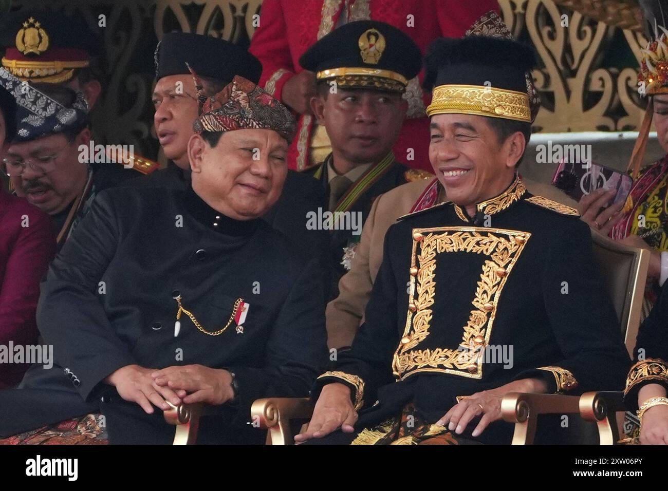 Indonesian President Joko Widodo, right, confers with Defense Minister ...