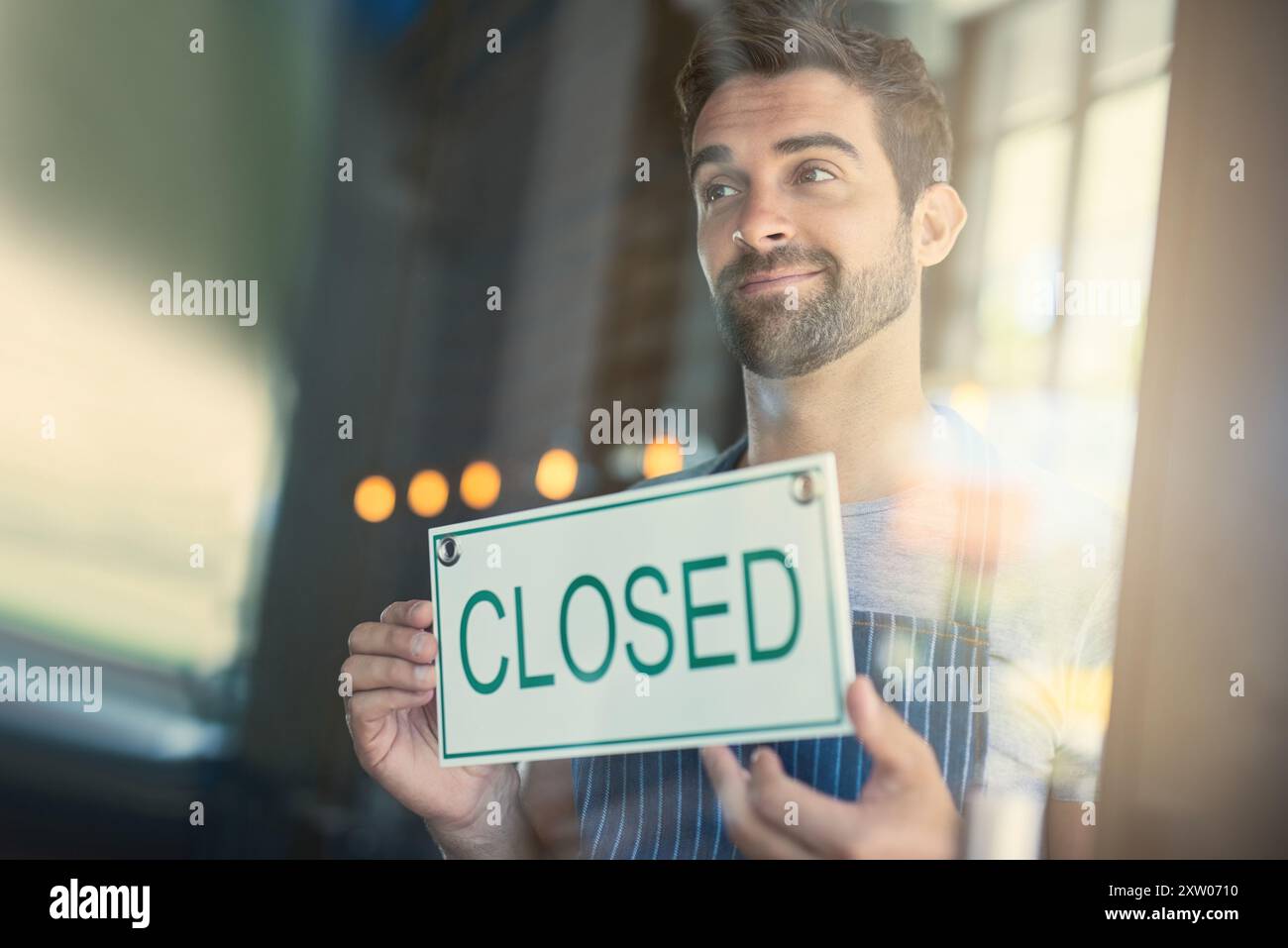 Barista, man and closed sign of coffee shop with business owner at ...