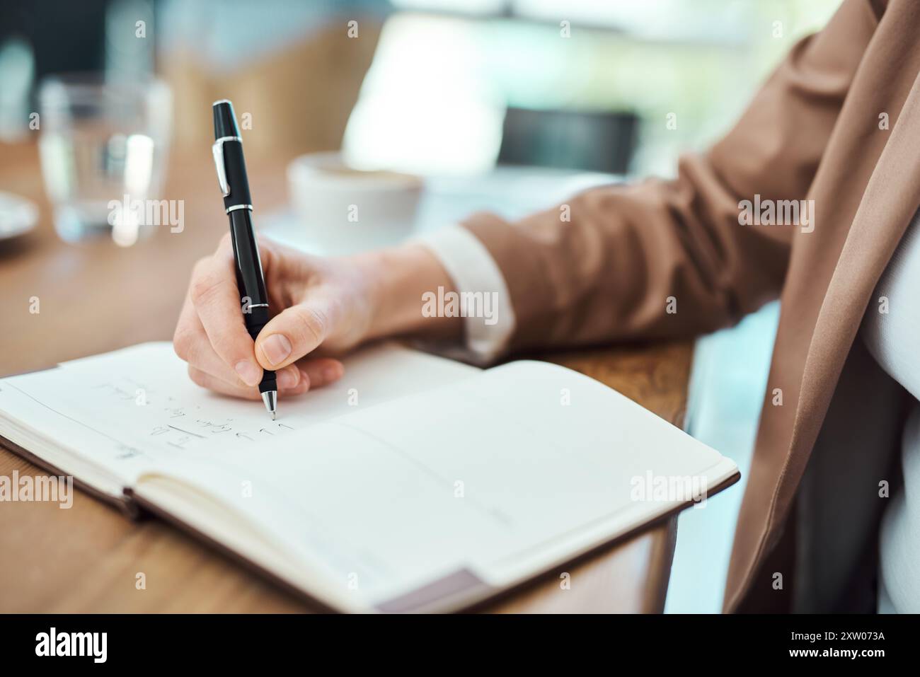 Businesswoman, hands and writing in notebook in office for task list ...