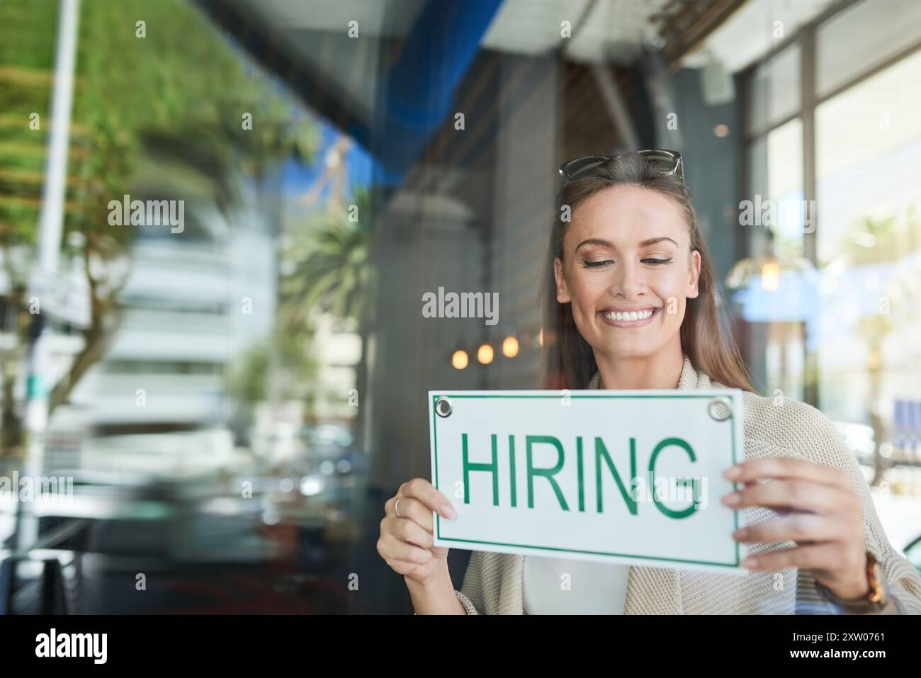 Happy, business and woman with hiring sign of startup announcement ...