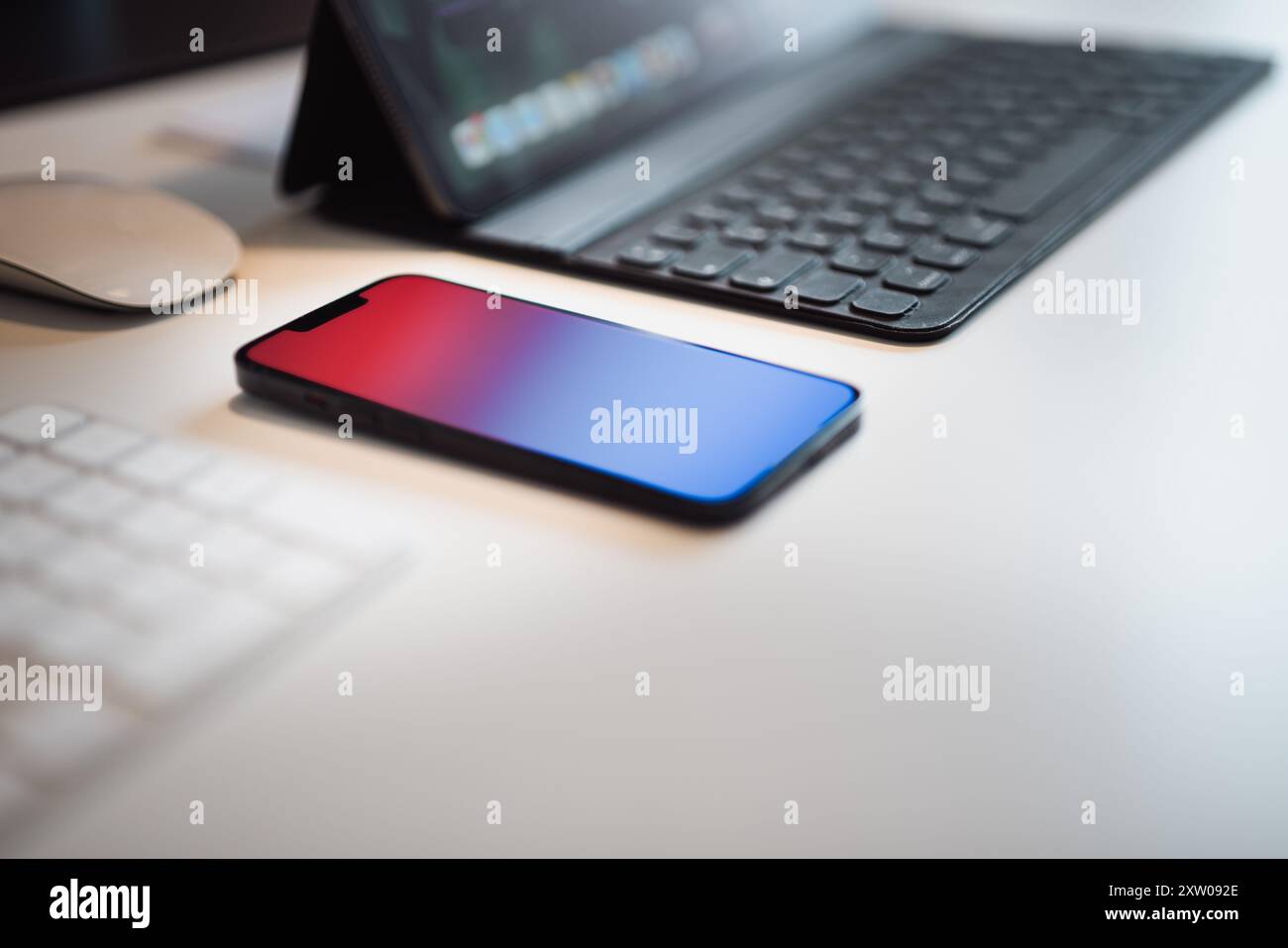 Smart phone and keyboard on home office studio table Stock Photo - Alamy