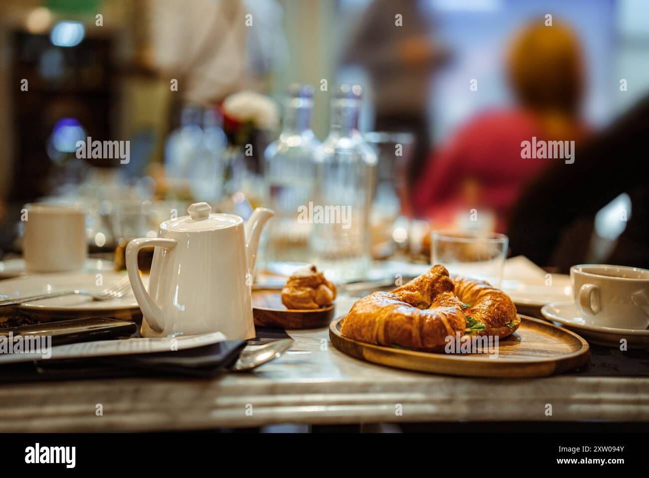 Breakfast coffee table. Food table. Vroisants and tea Stock Photo - Alamy