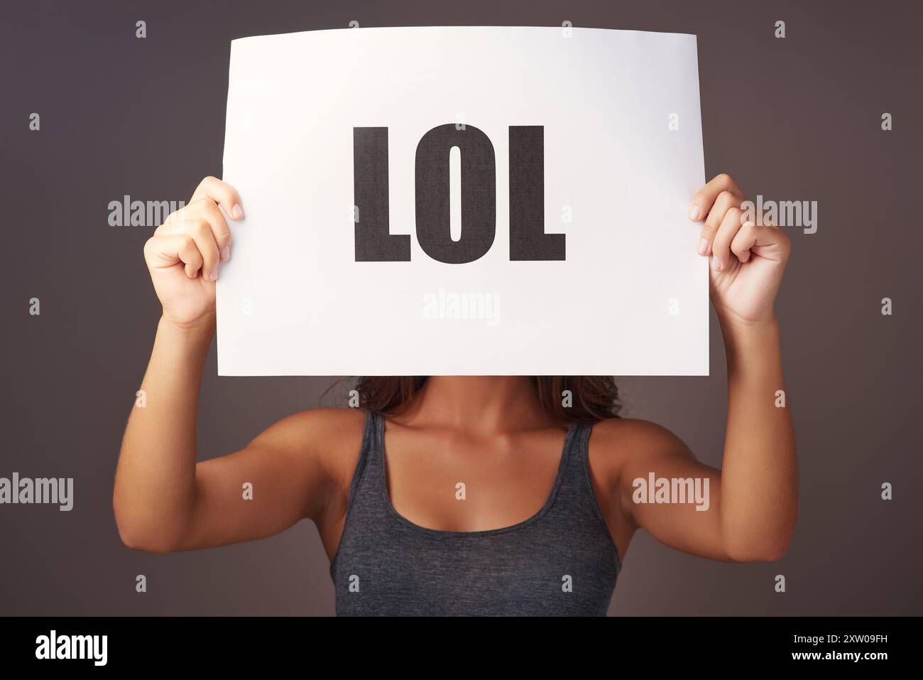 Studio, woman and poster with lol for message, reaction and laughter in ...