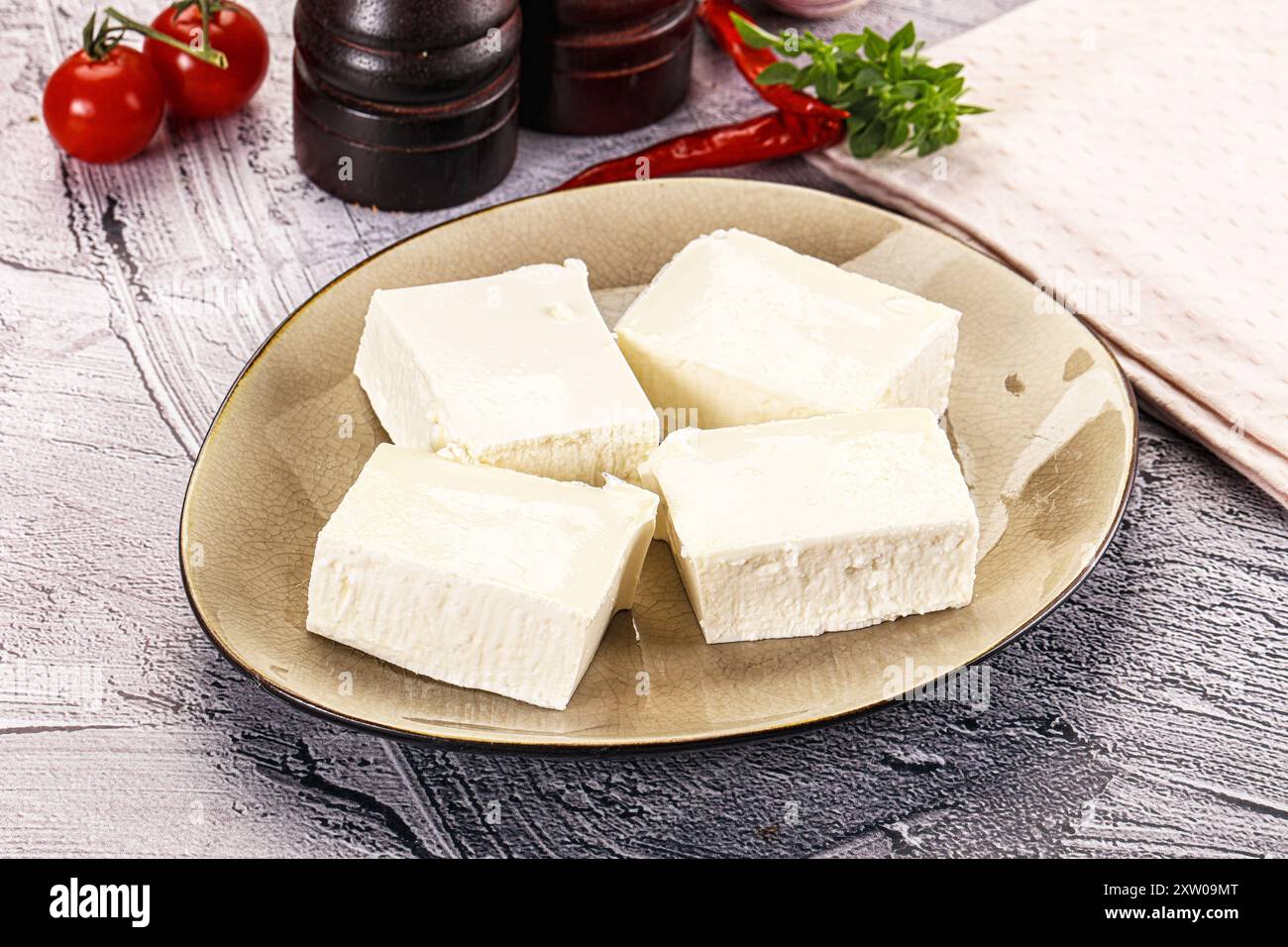 Greek traditional cuisine - Feta cheese bricks Stock Photo - Alamy