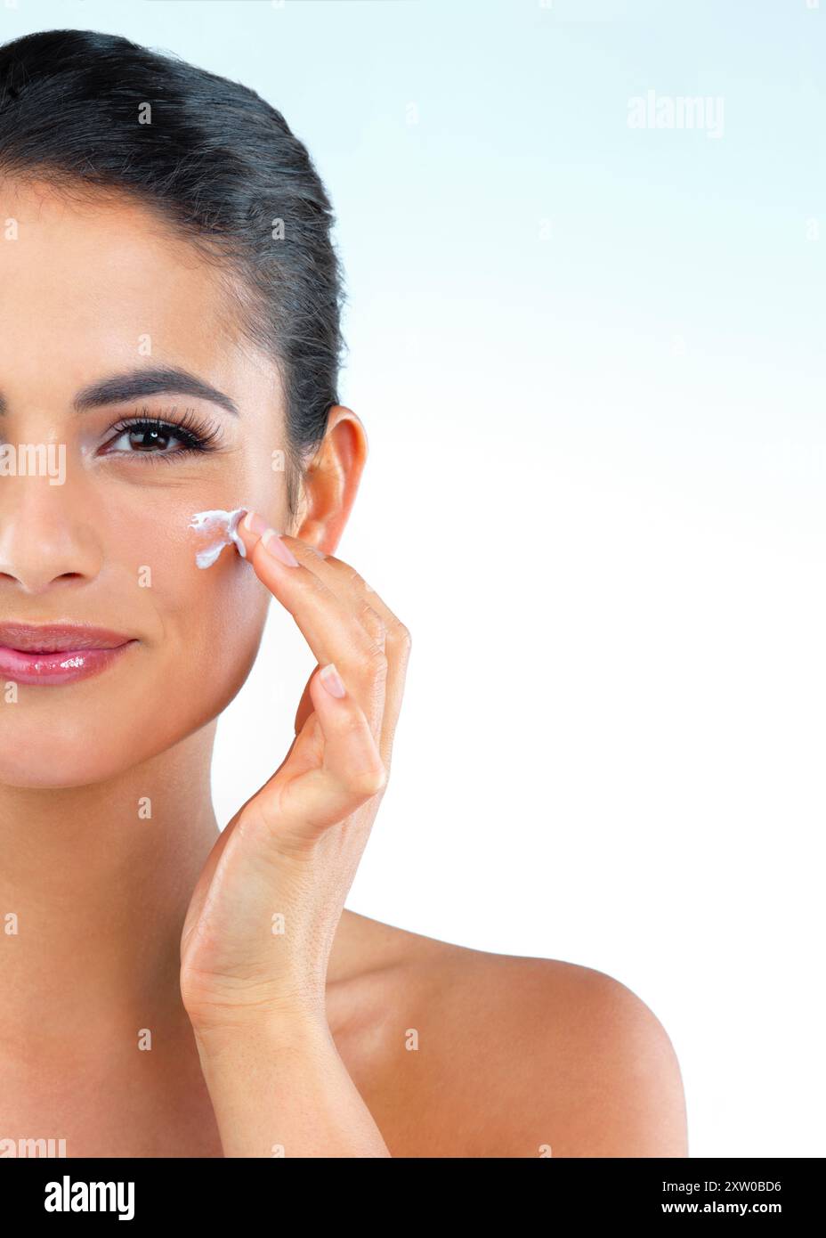 Woman, cosmetics and portrait with cream in studio for beauty, glow and ...