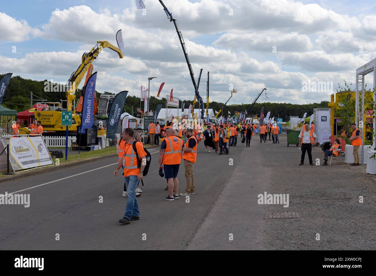 People in orange railway High Visibility clothing at Rail Live, railway ...