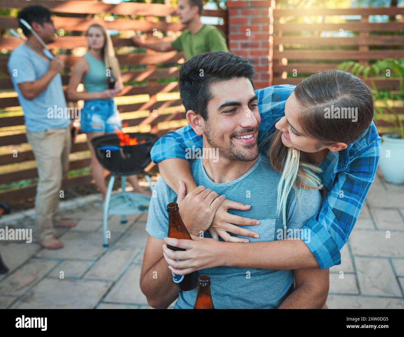 Couple, barbeque and backyard with hug, party and labor day event with ...