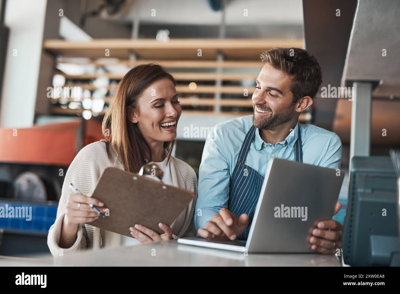Small business, happy and couple in cafe with laptop, positive review ...